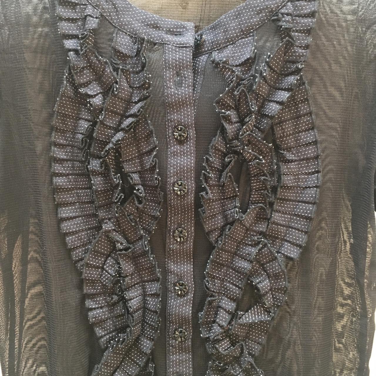Transparent black button up top. Details at front... - Depop