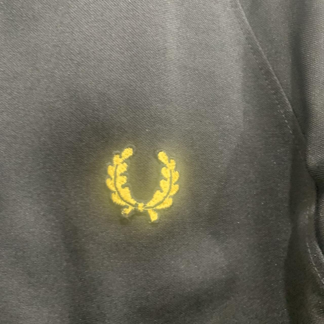 Black and yellow Fred Perry track top, very slight... - Depop