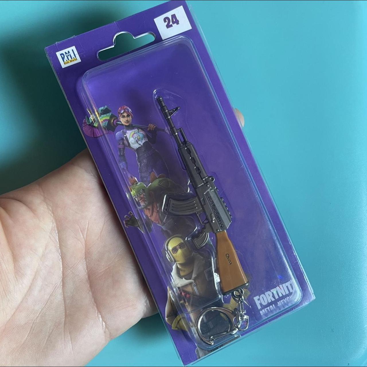 Fortnite Gun Keychain Keyring 🔥Only 2 Left in stock... - Depop