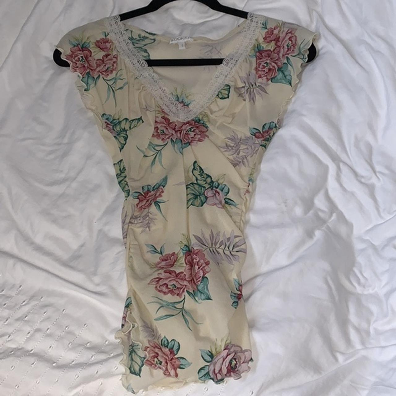 Ruched flower top with flutter sleeves Fits size 6,8... - Depop