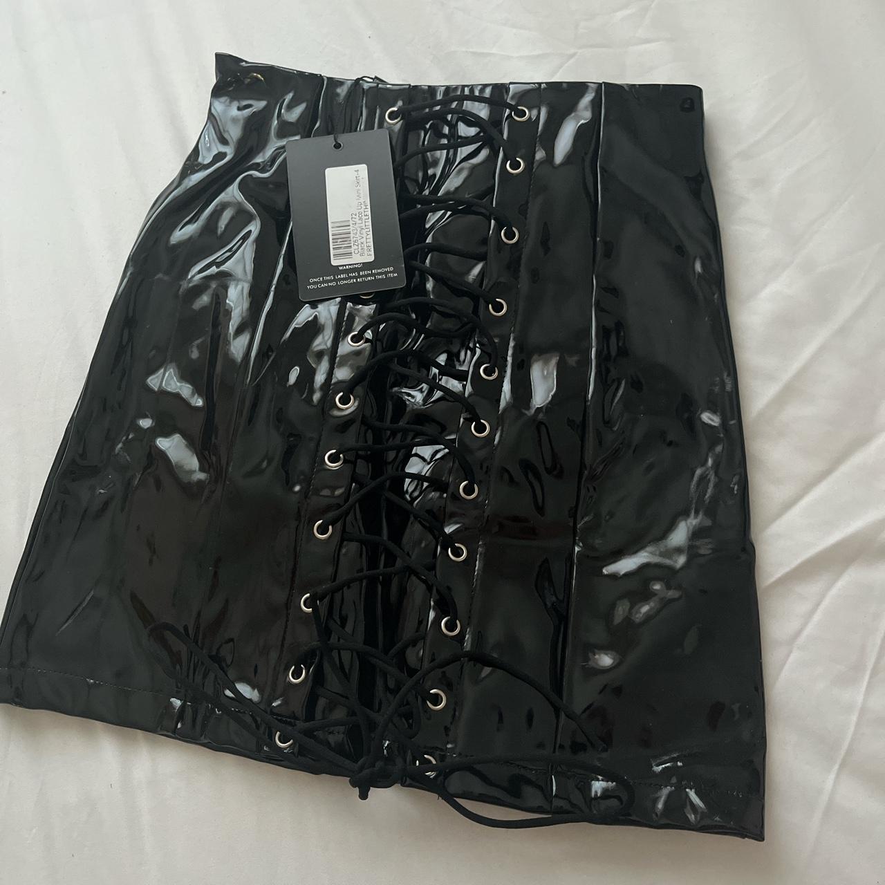 Black vinyl lace up mini skirt with side zip.... - Depop