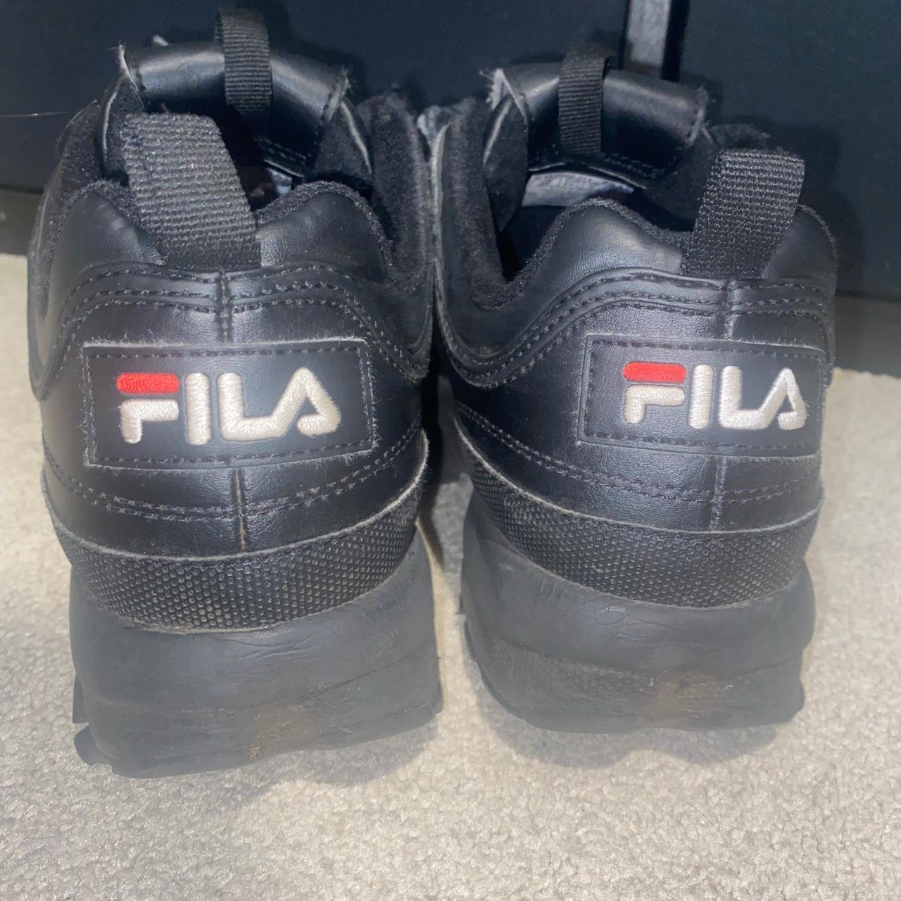 Black fila trainers good condition only worn a few... - Depop