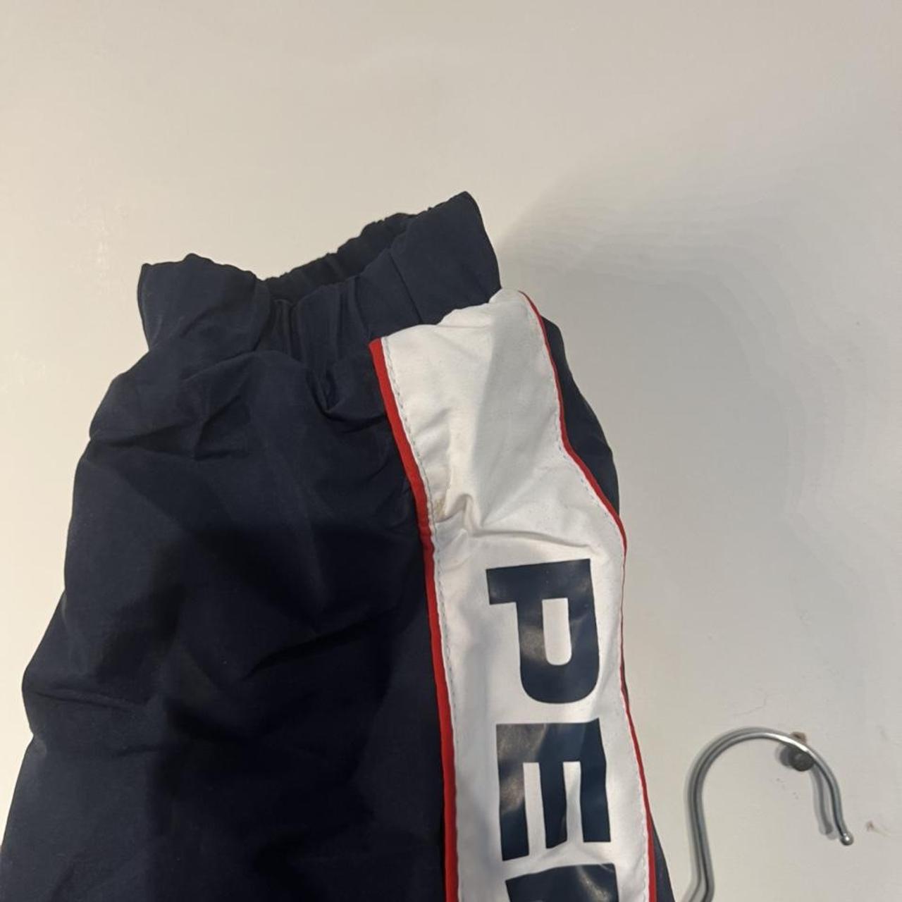 Penn sport blue tracksuit bottoms with design on... - Depop