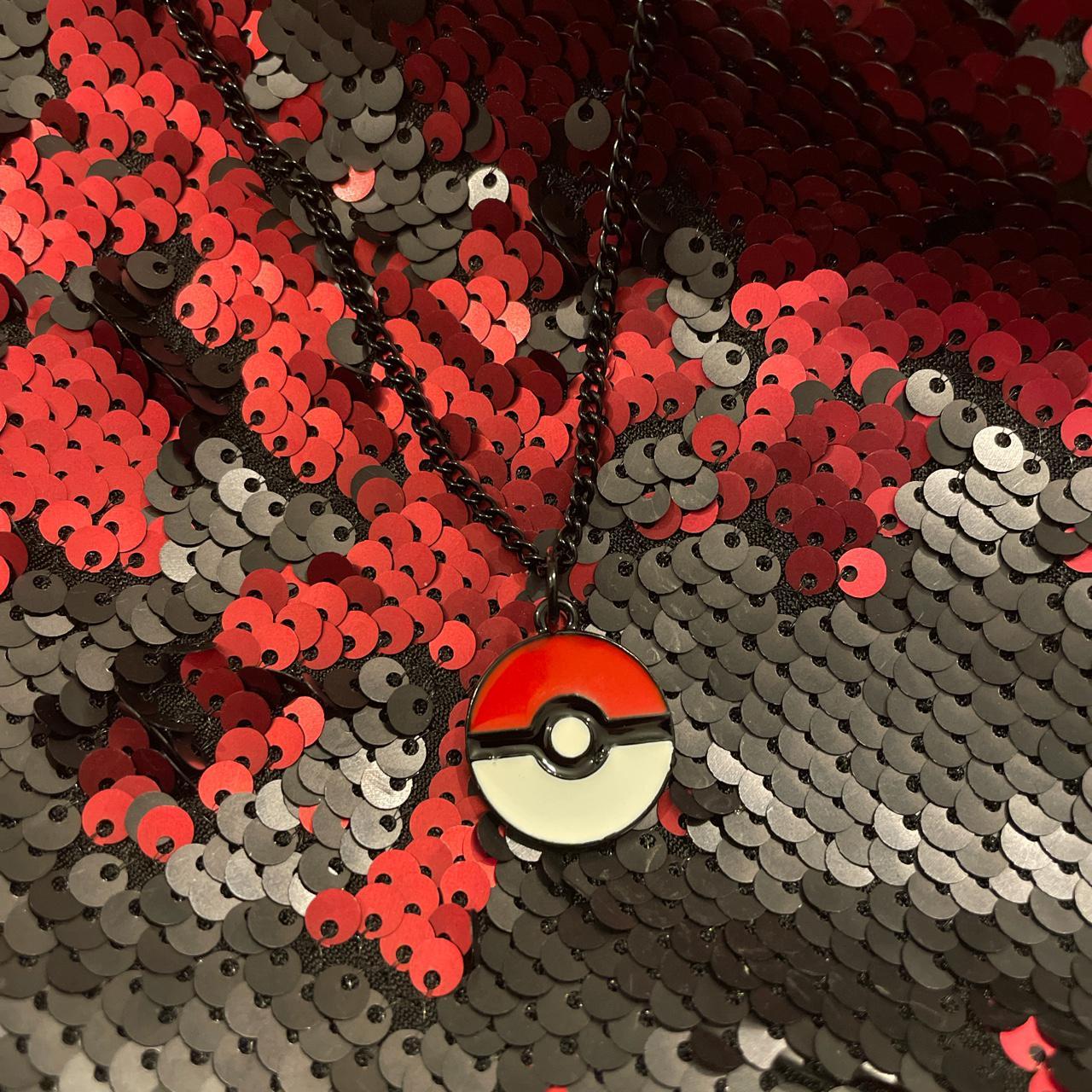 Cute metal Pokémon pokeball necklace with black... - Depop