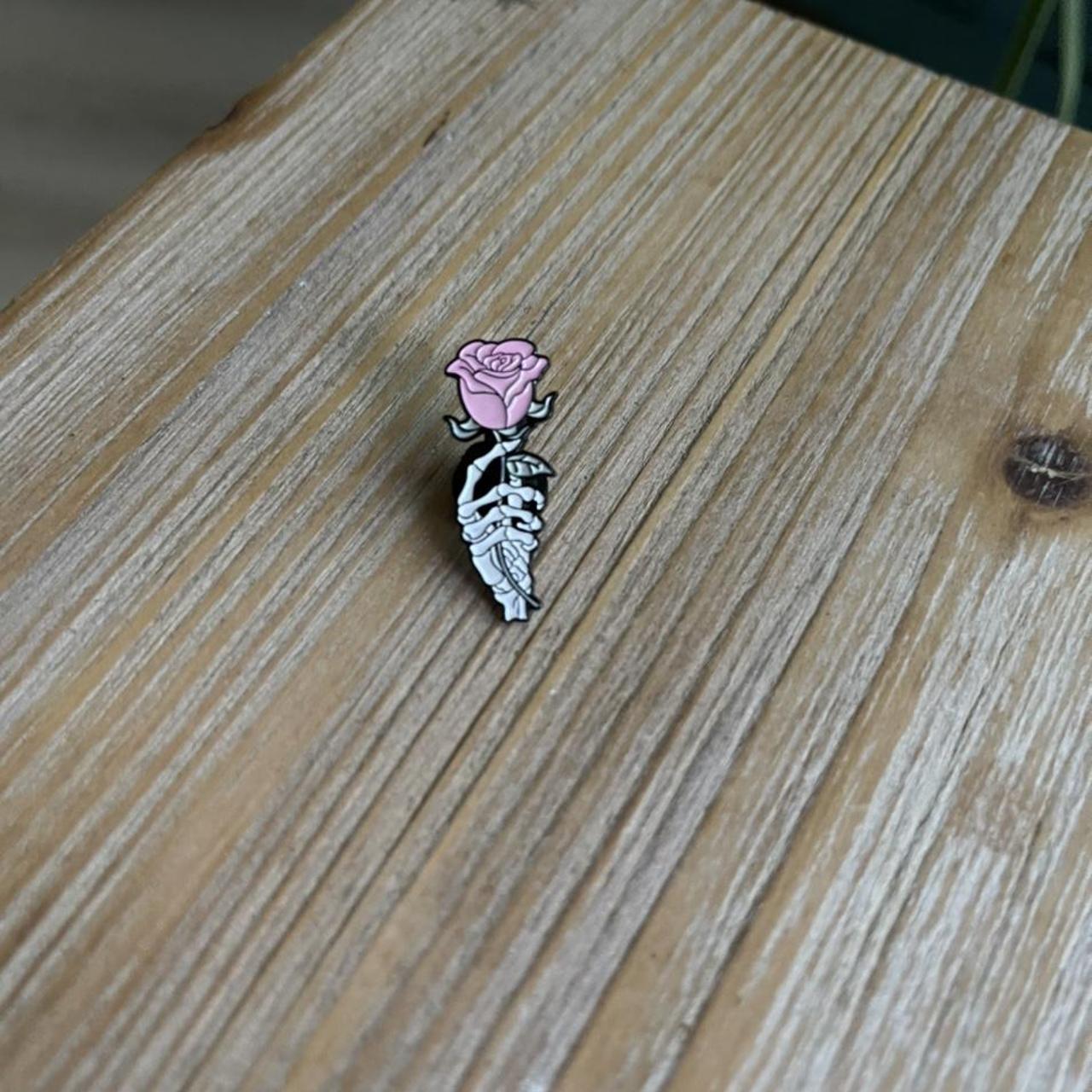 Skeleton hand enamel pin