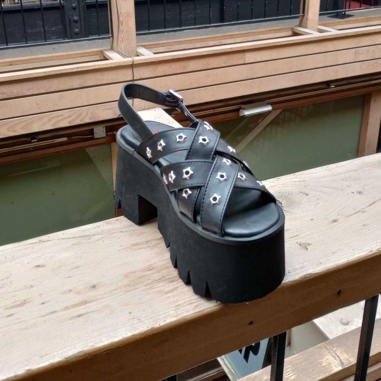 The Demonia Ashes-12 in black has a 3" platform with... - Depop