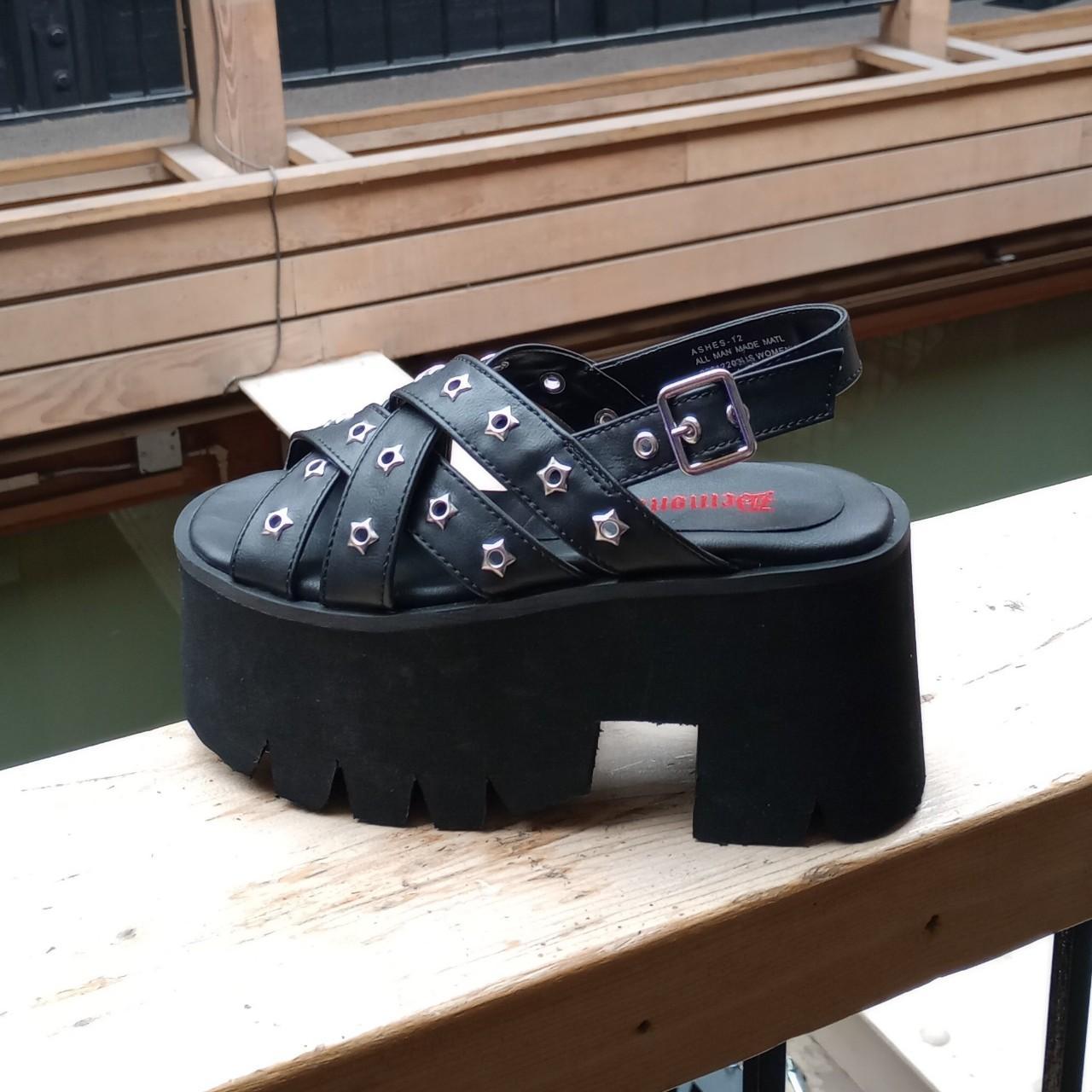 The Demonia Ashes-12 in black has a 3" platform with... - Depop