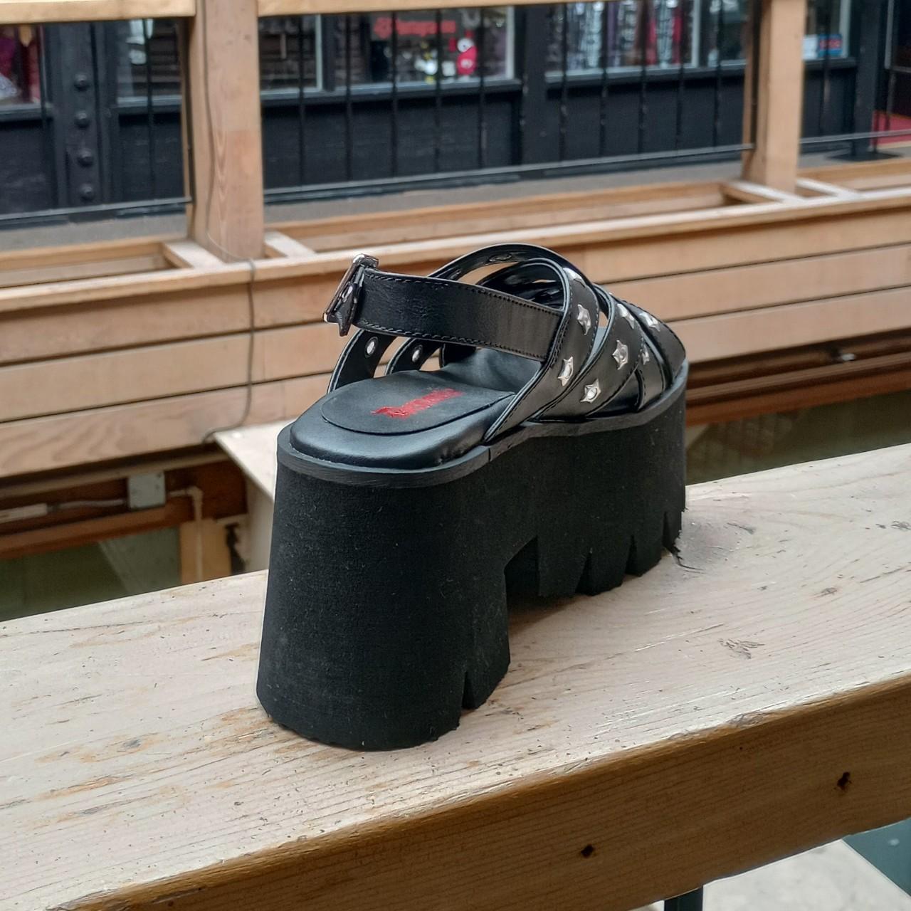 The Demonia Ashes-12 in black has a 3" platform with... - Depop