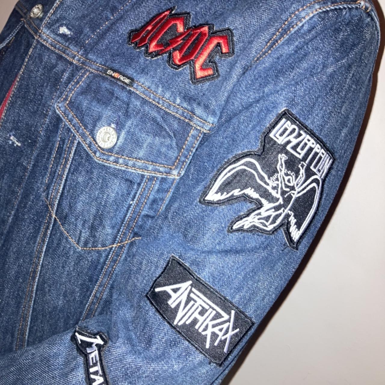 Blue denim jacket with stitched on patches of famous... - Depop
