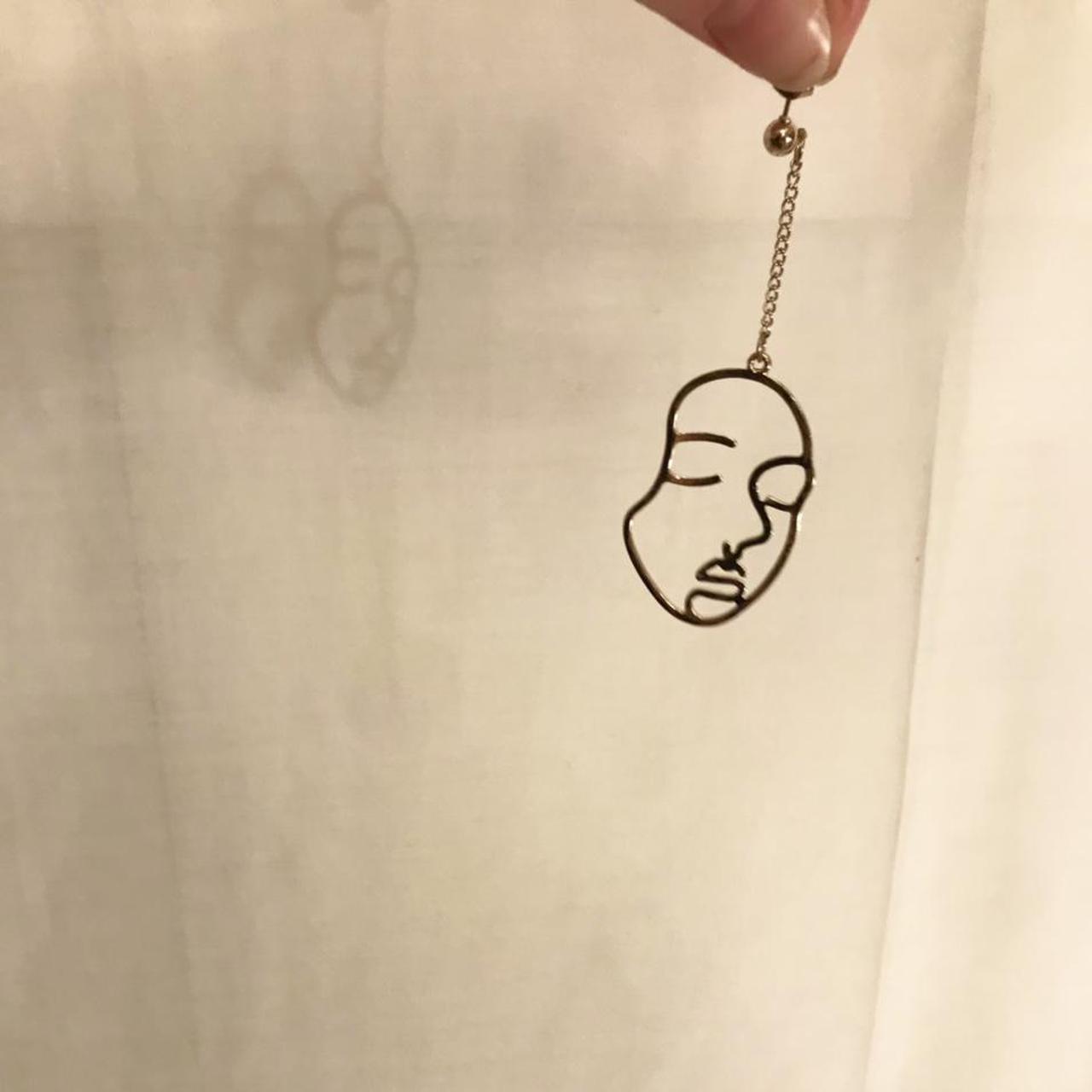 Cool gold colour dangly face earrings. Great... - Depop