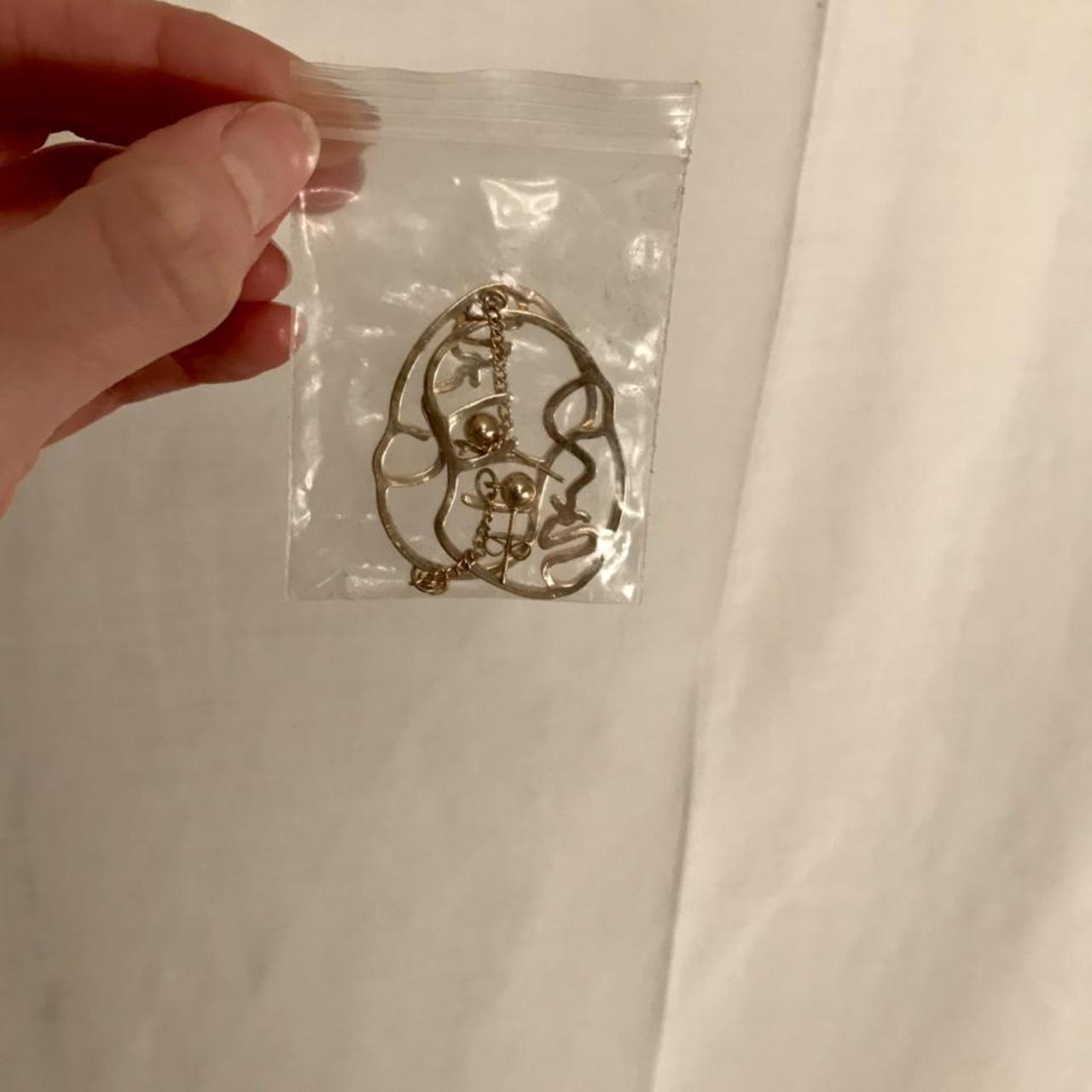 Cool gold colour dangly face earrings. Great... - Depop