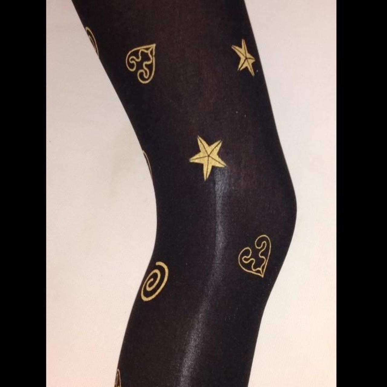 Gold print on footless tights. Black with star,... - Depop