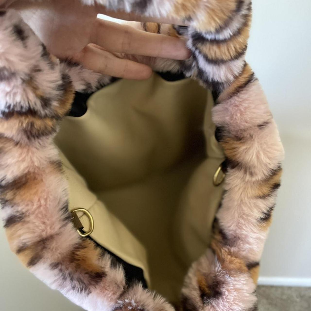 the cutest pink fluffy purse with leather interior... - Depop