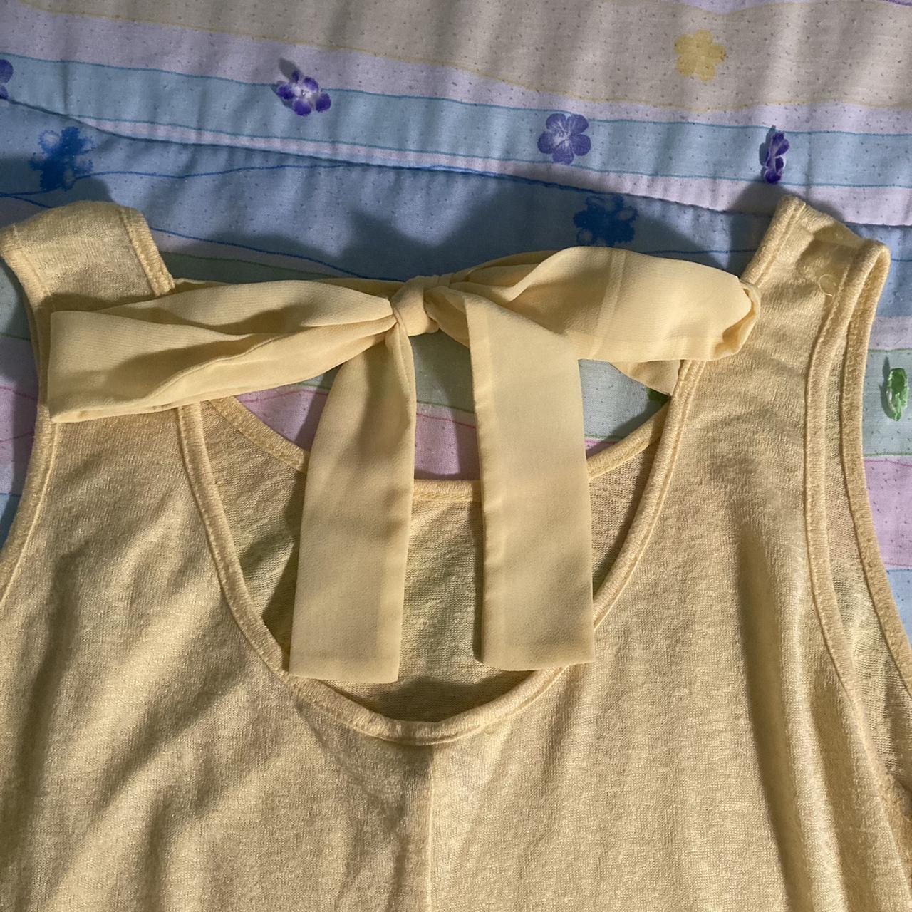 Custard pastel yellow tank top with yellow ribbon... - Depop