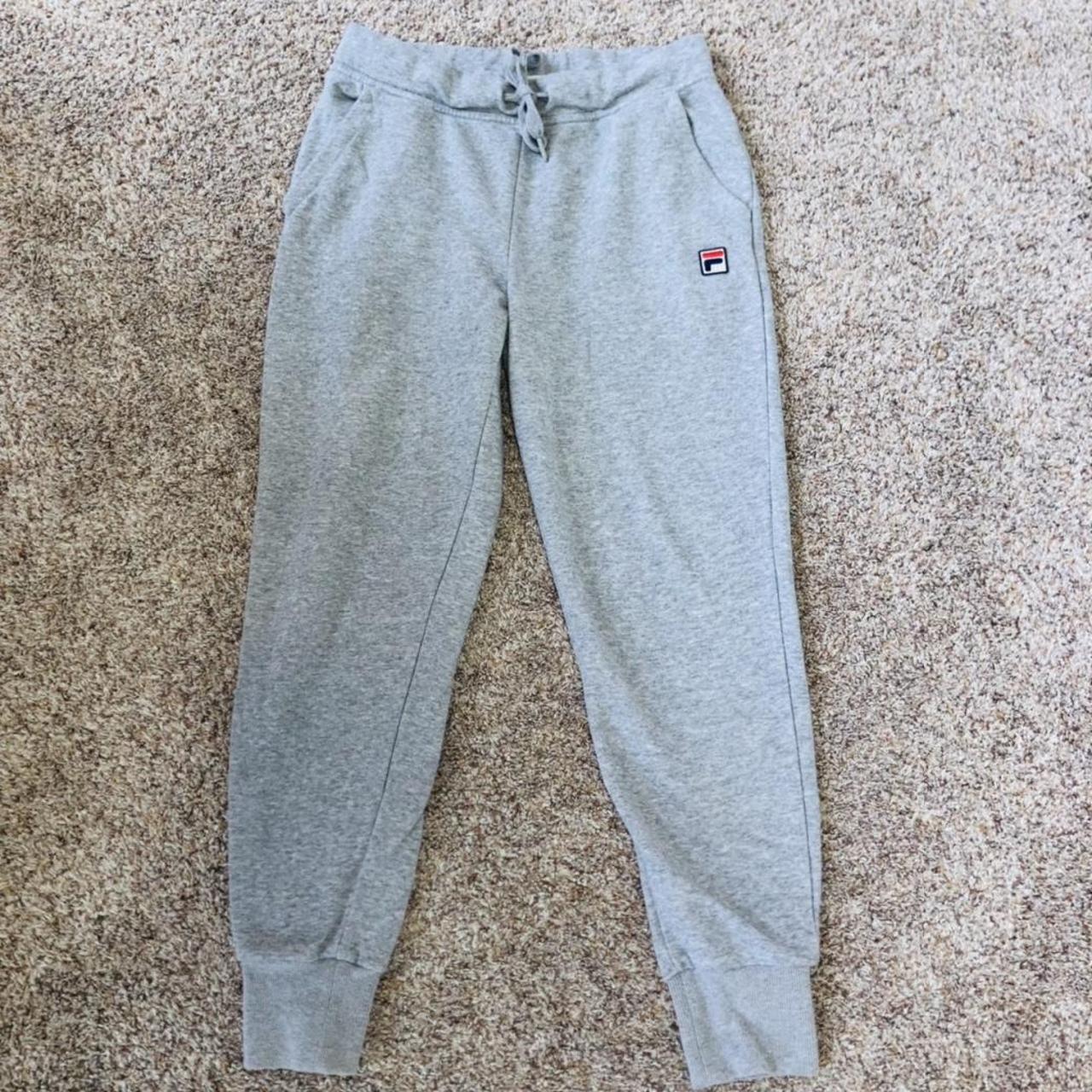 Grey fila sweatpants Size small but could fit a... - Depop