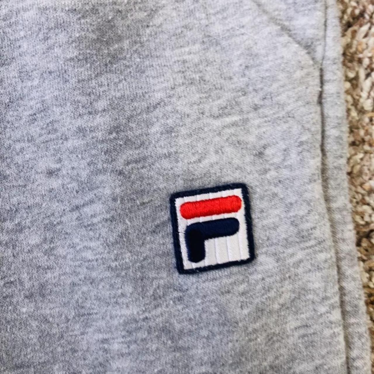 Grey fila sweatpants Size small but could fit a... - Depop