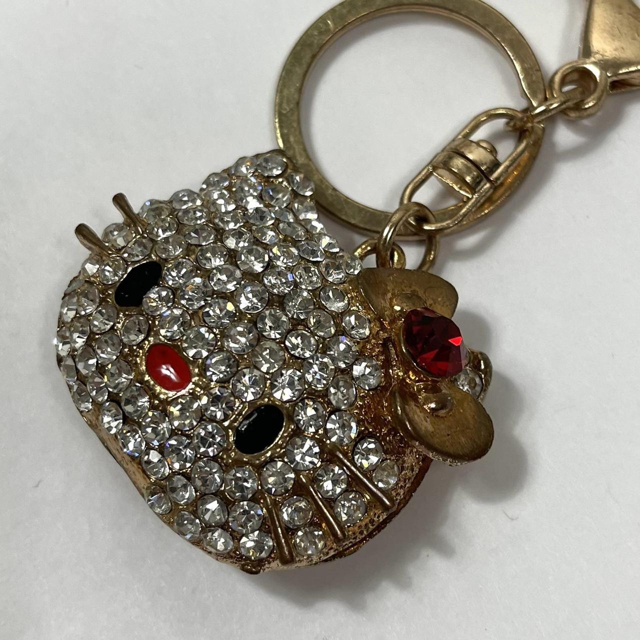 Gold Hello Kitty keychain with sparkly gemstone... - Depop