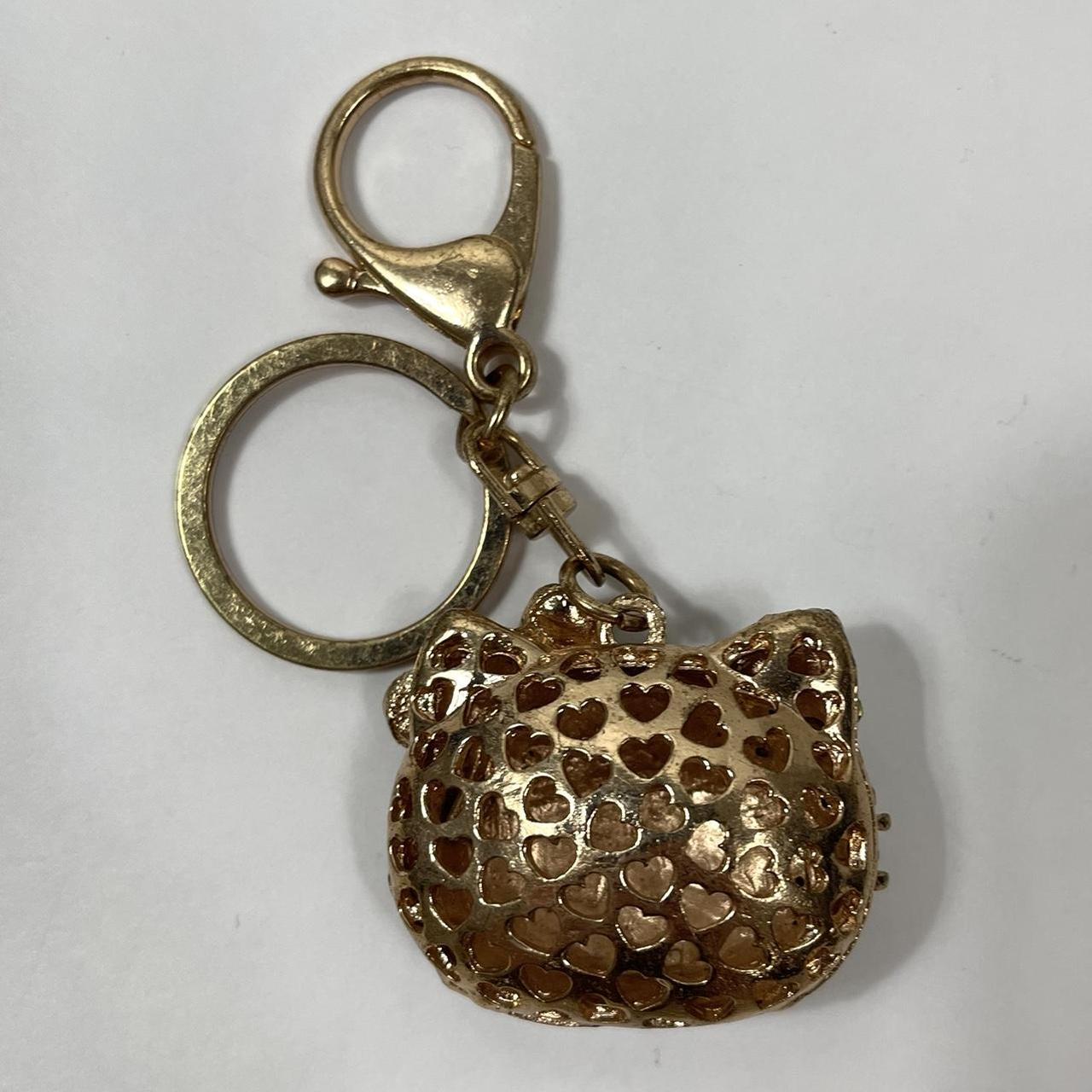 Gold Hello Kitty keychain with sparkly gemstone... - Depop