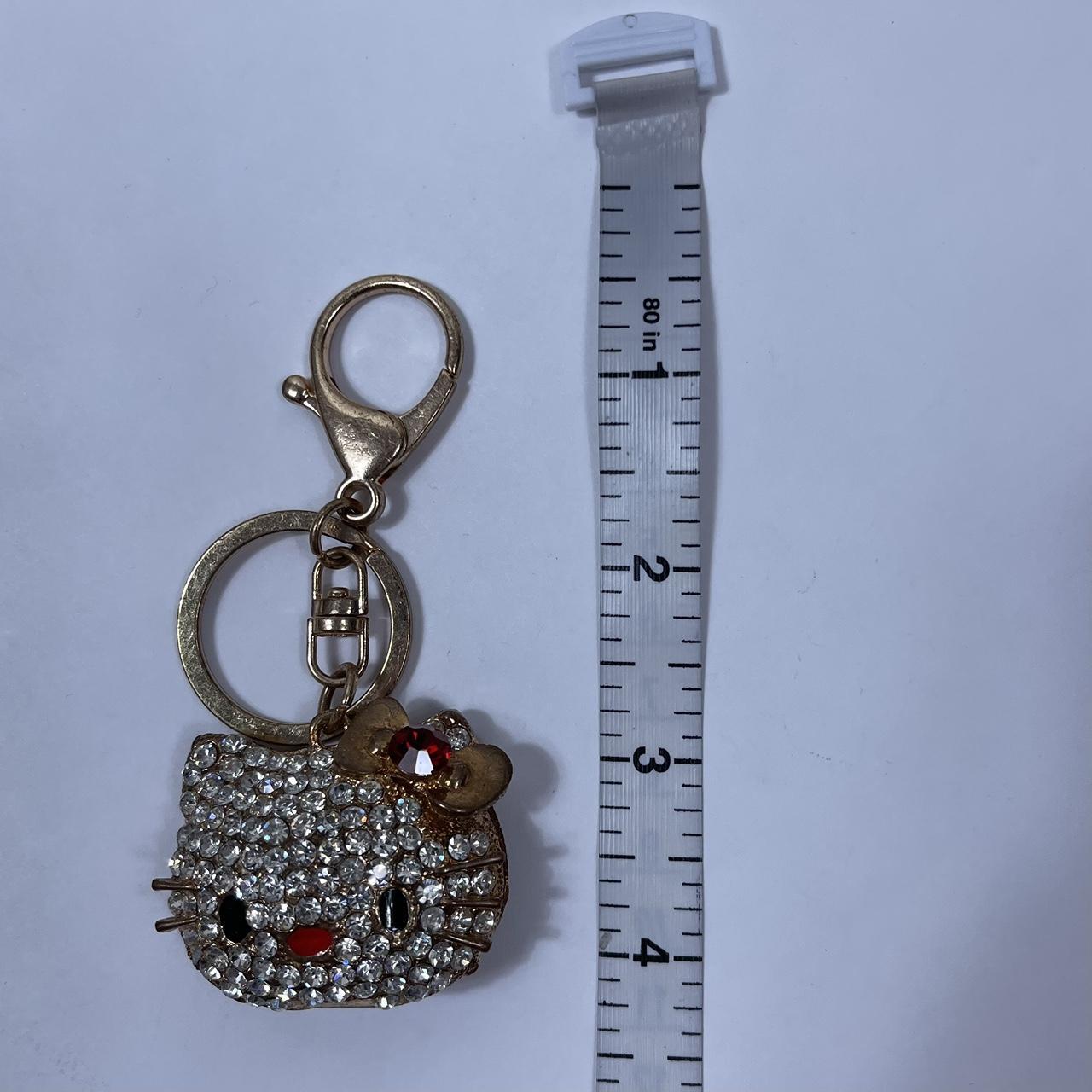 Gold Hello Kitty keychain with sparkly gemstone... - Depop