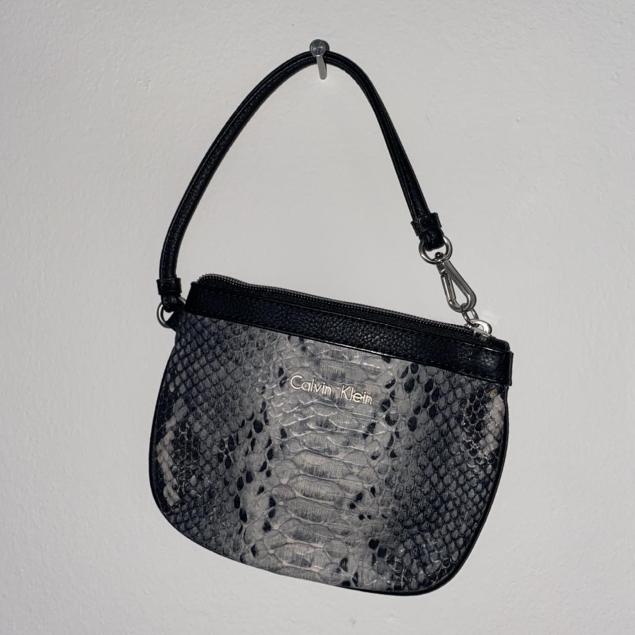 Calvin Klein snake skin coin purse never been used - Depop