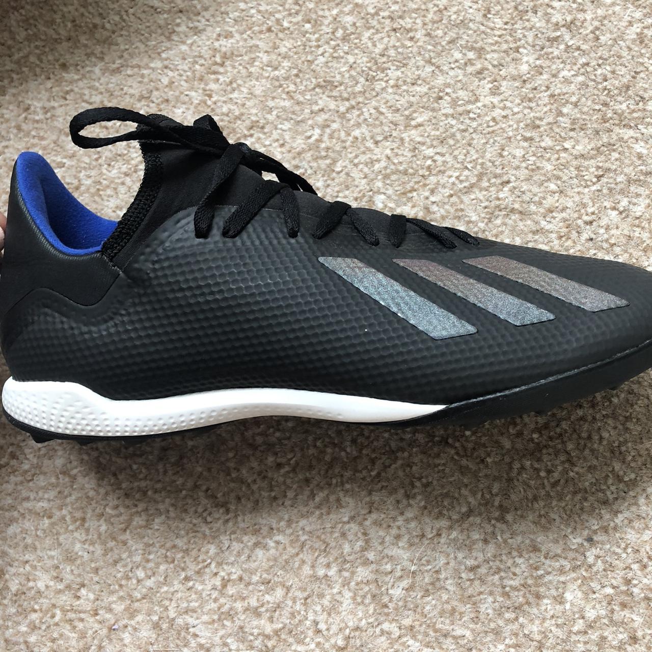 black Adidas astro boots with holographic stripes... - Depop