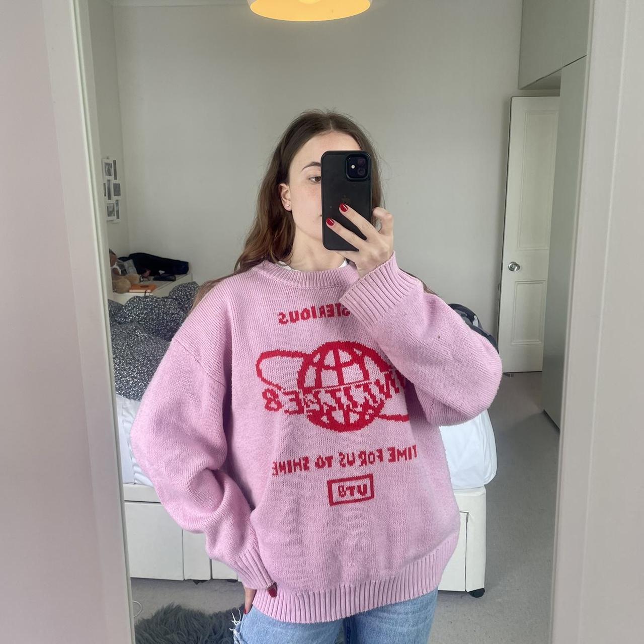 pink knitted jumper with red graphic on it. perfect... - Depop
