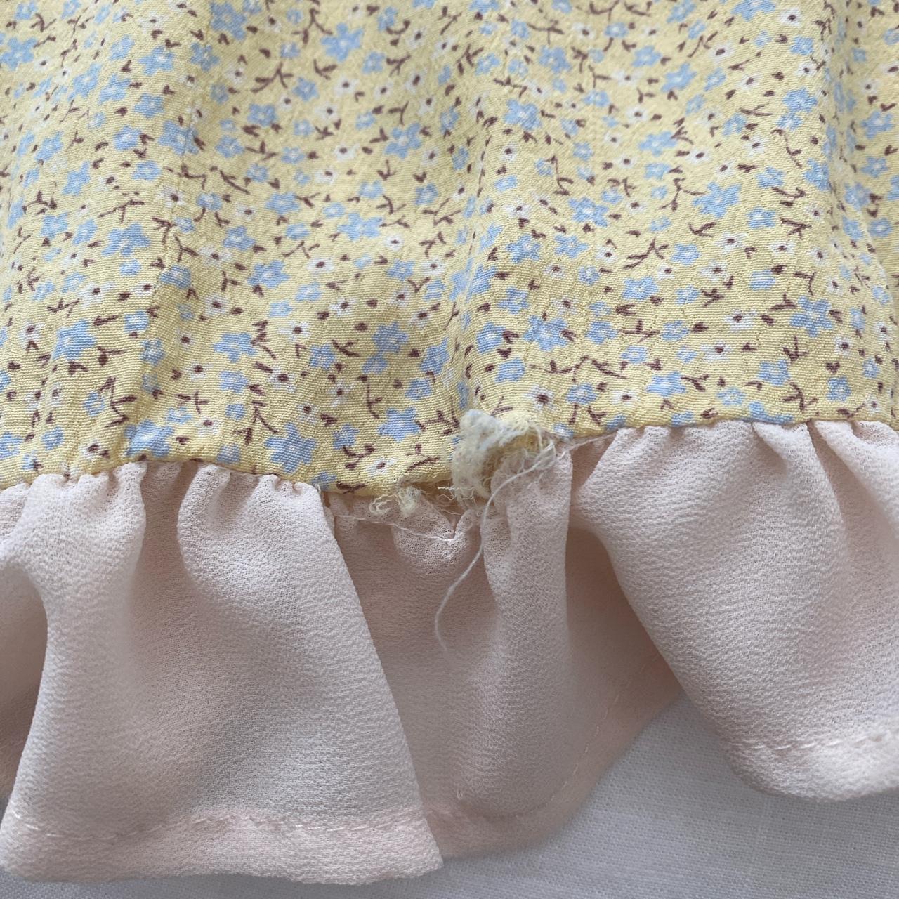 beautiful floral dress. Inseams seem to be weak from... - Depop