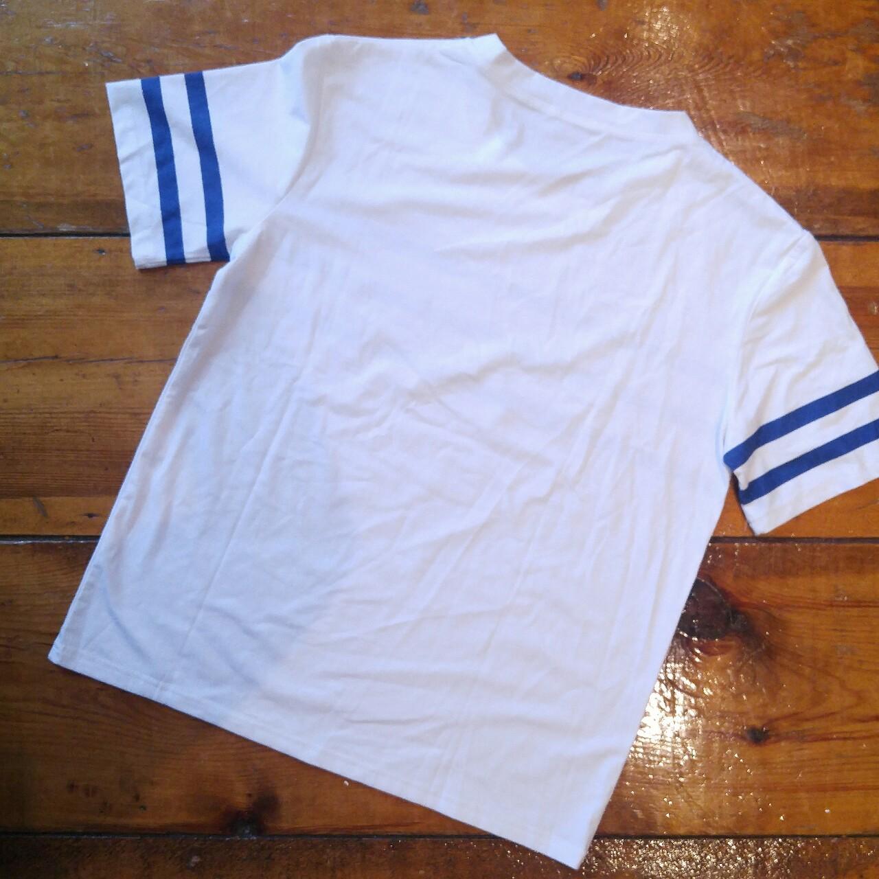 Plain white tee with blue stripes · Was a one size... - Depop