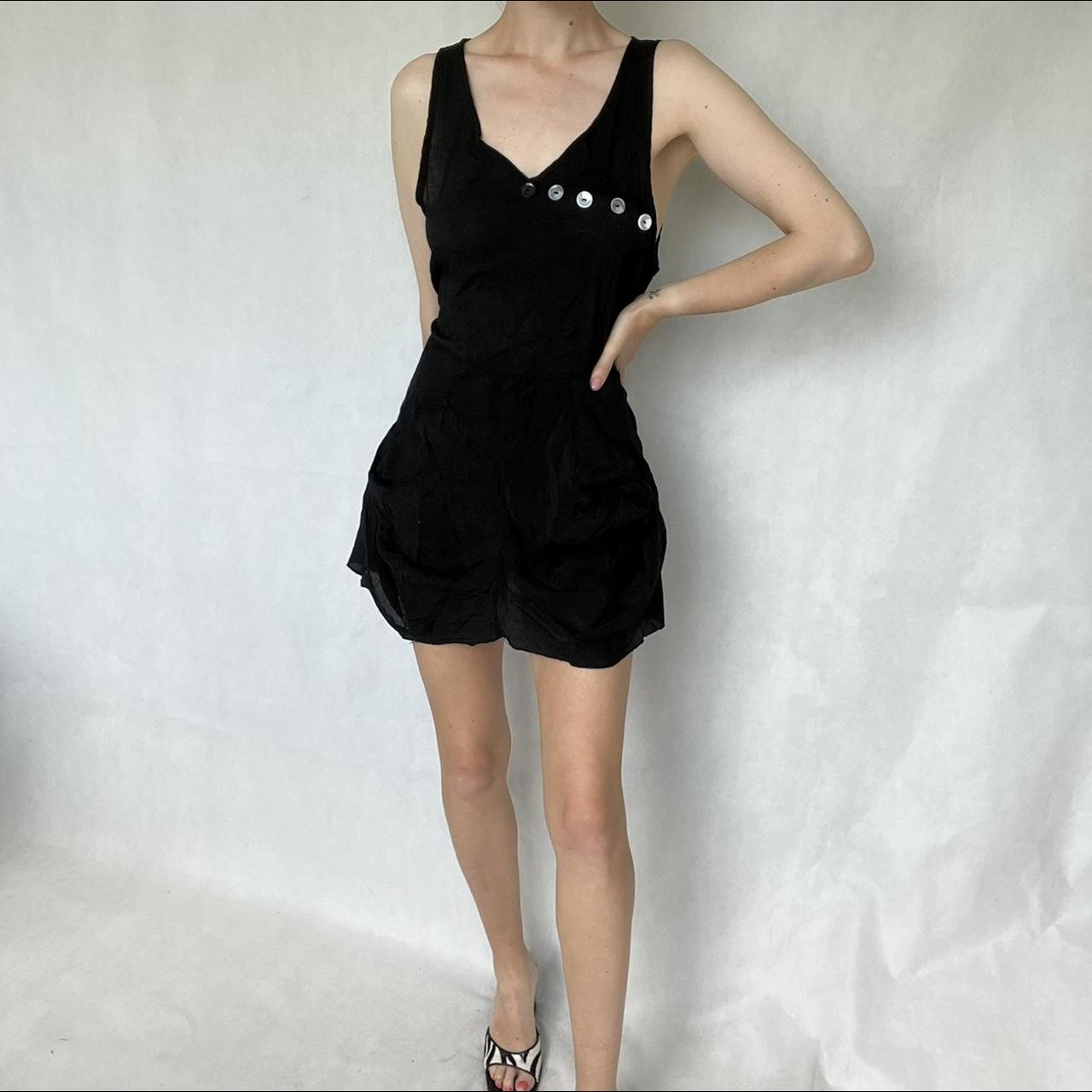 Coolest black sleeveless mini dress with funky... - Depop