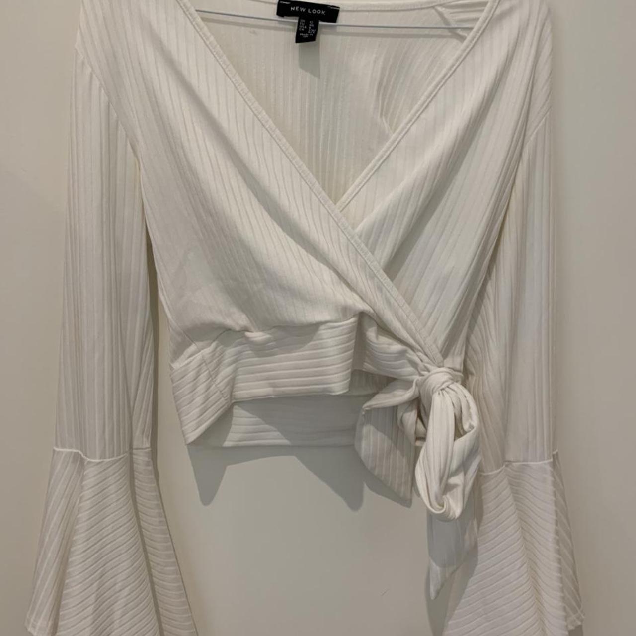 Stunning white cross over blouse with ties with bell... - Depop