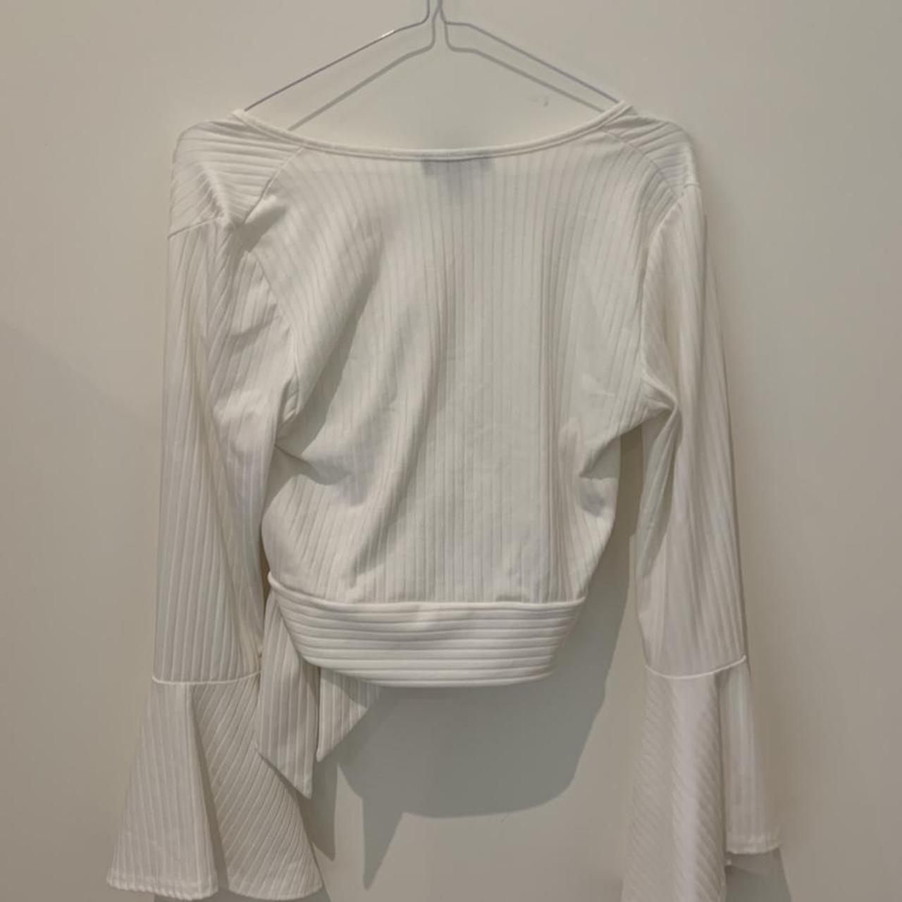Stunning white cross over blouse with ties with bell... - Depop
