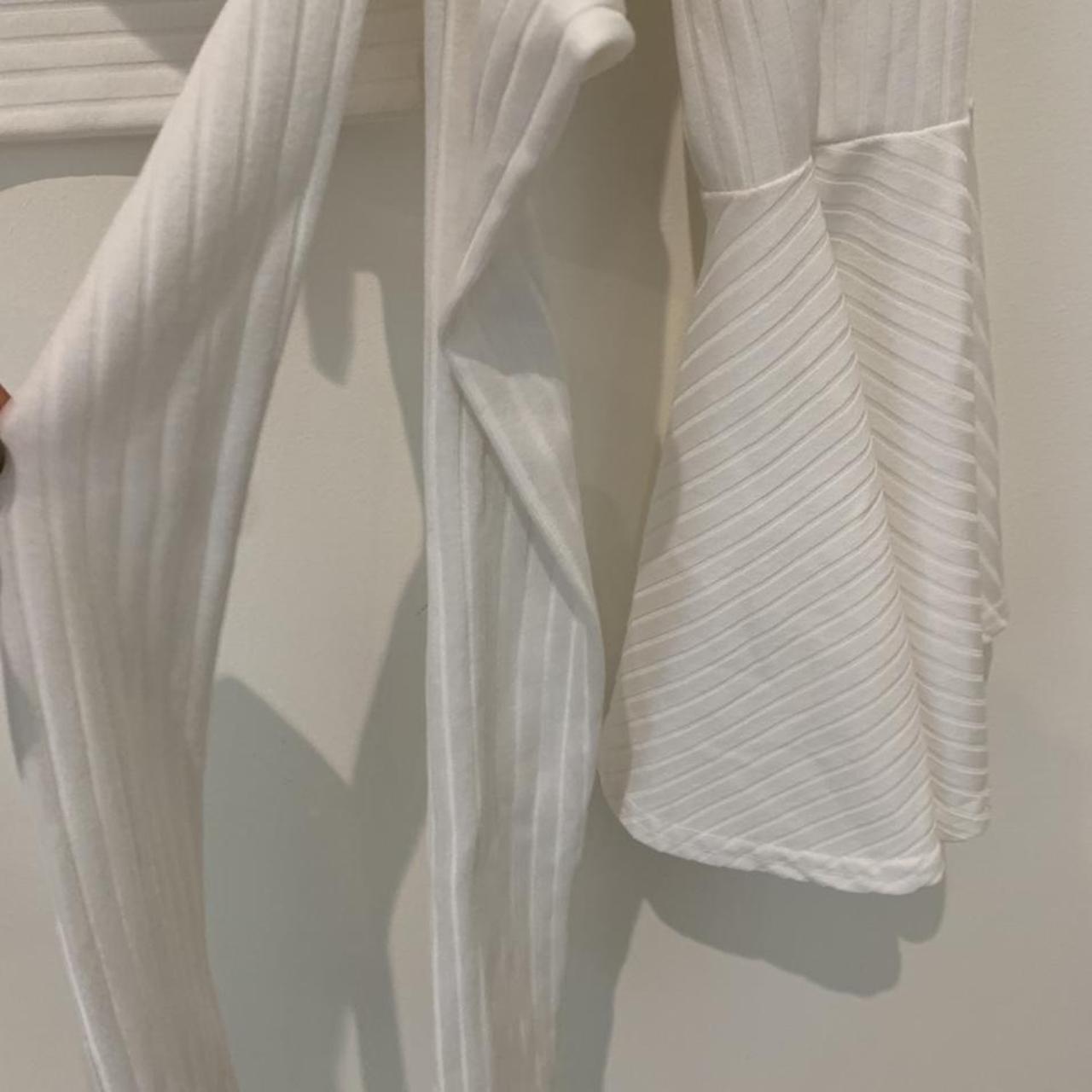 Stunning white cross over blouse with ties with bell... - Depop