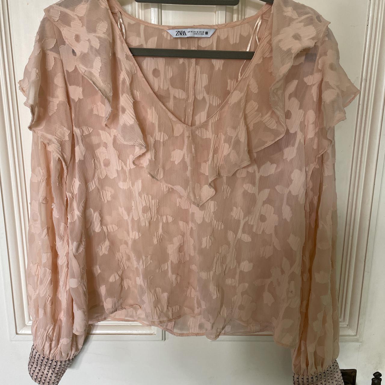 Pretty sheer pale pink blouse with ruffles around... - Depop