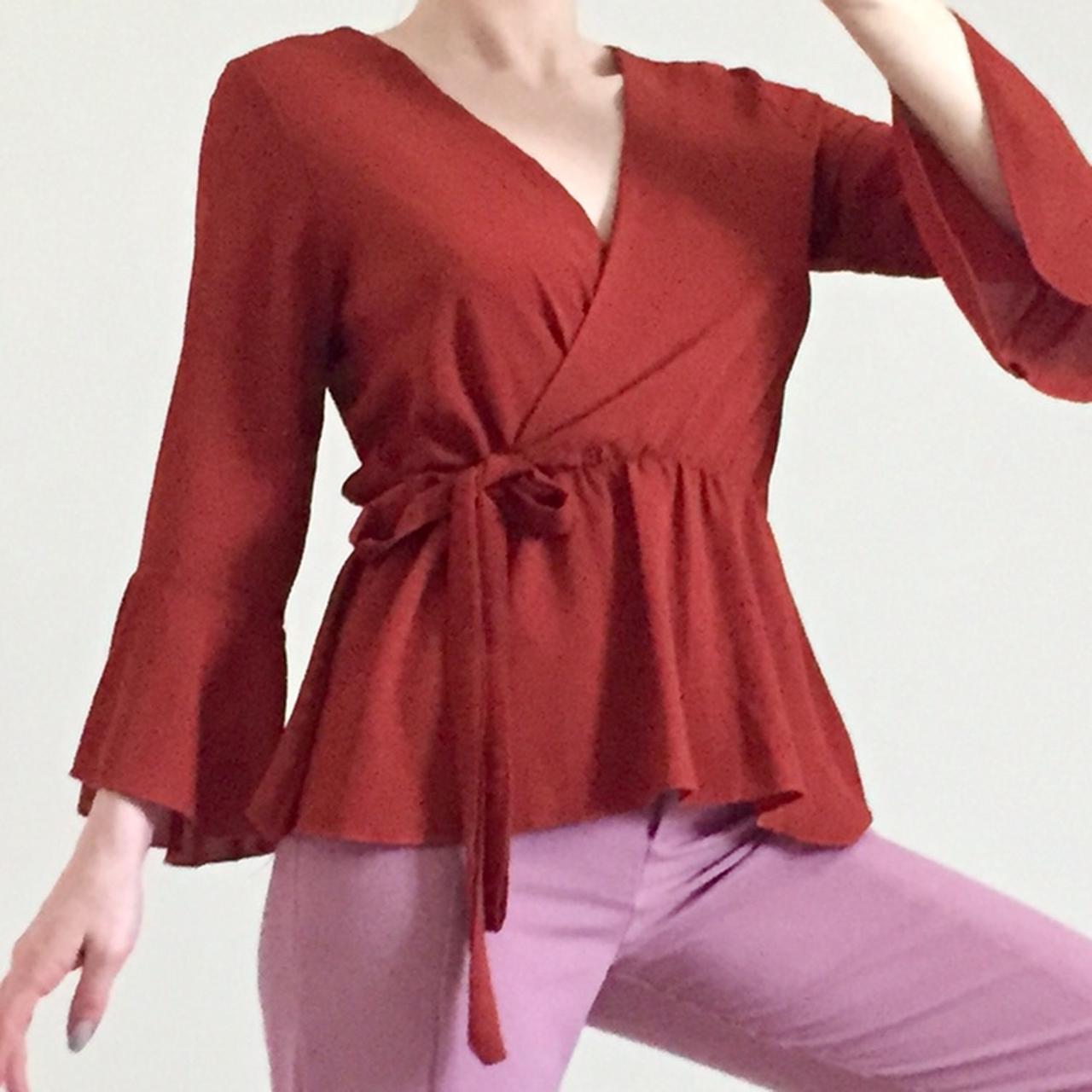 Blouse. Dark orange wrap top. Flared... - Depop