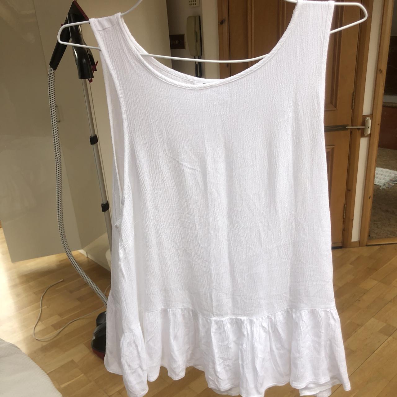 White sleeveless drop hem top. Sample from house of... - Depop