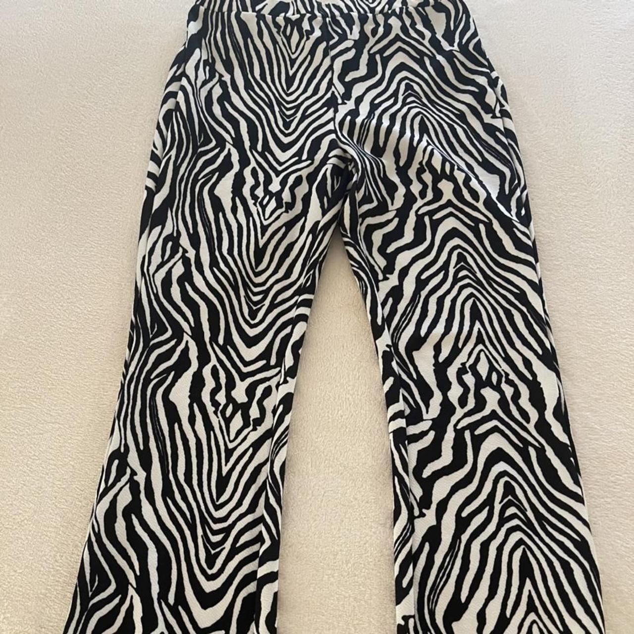 Zebra print pants, with slits on the bottoms - Depop
