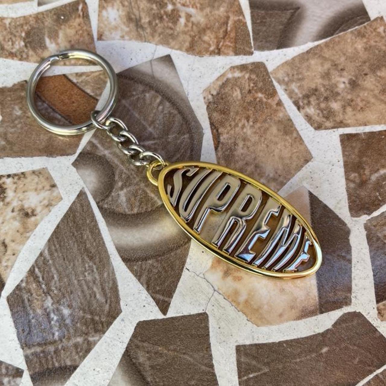Supreme Oval logo Keychain silver & gold #supreme... - Depop