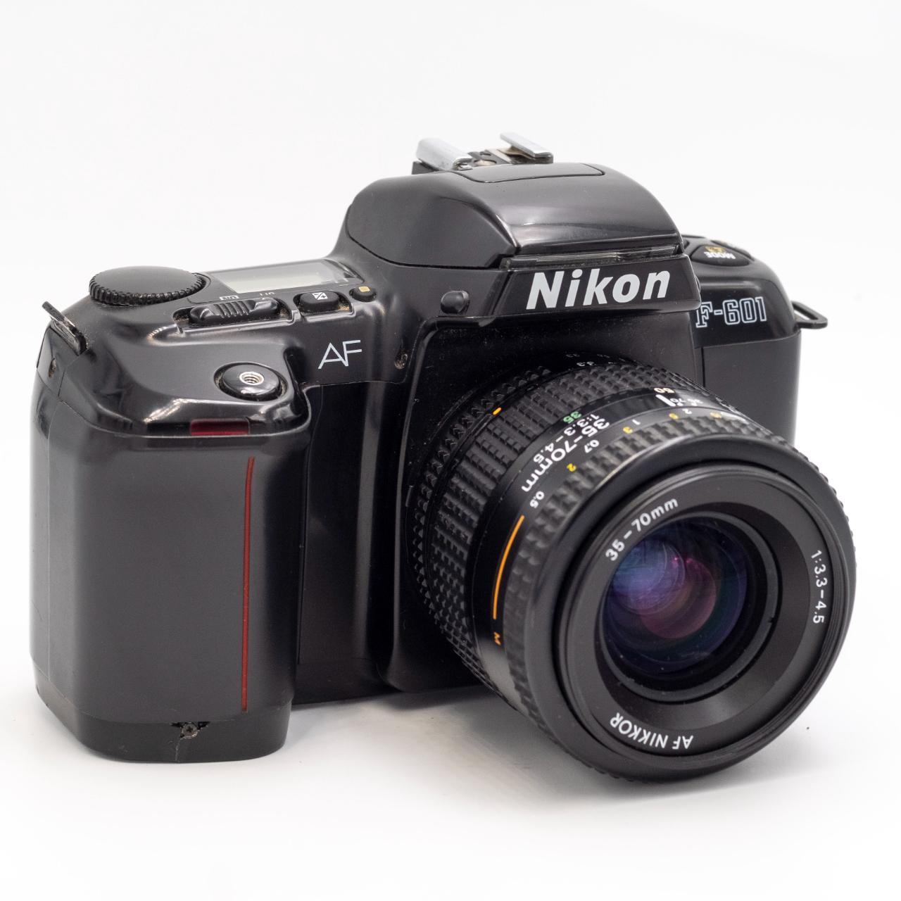 Early 1990s Nikon F601 with 35-70 Nikon zoom lens.... - Depop
