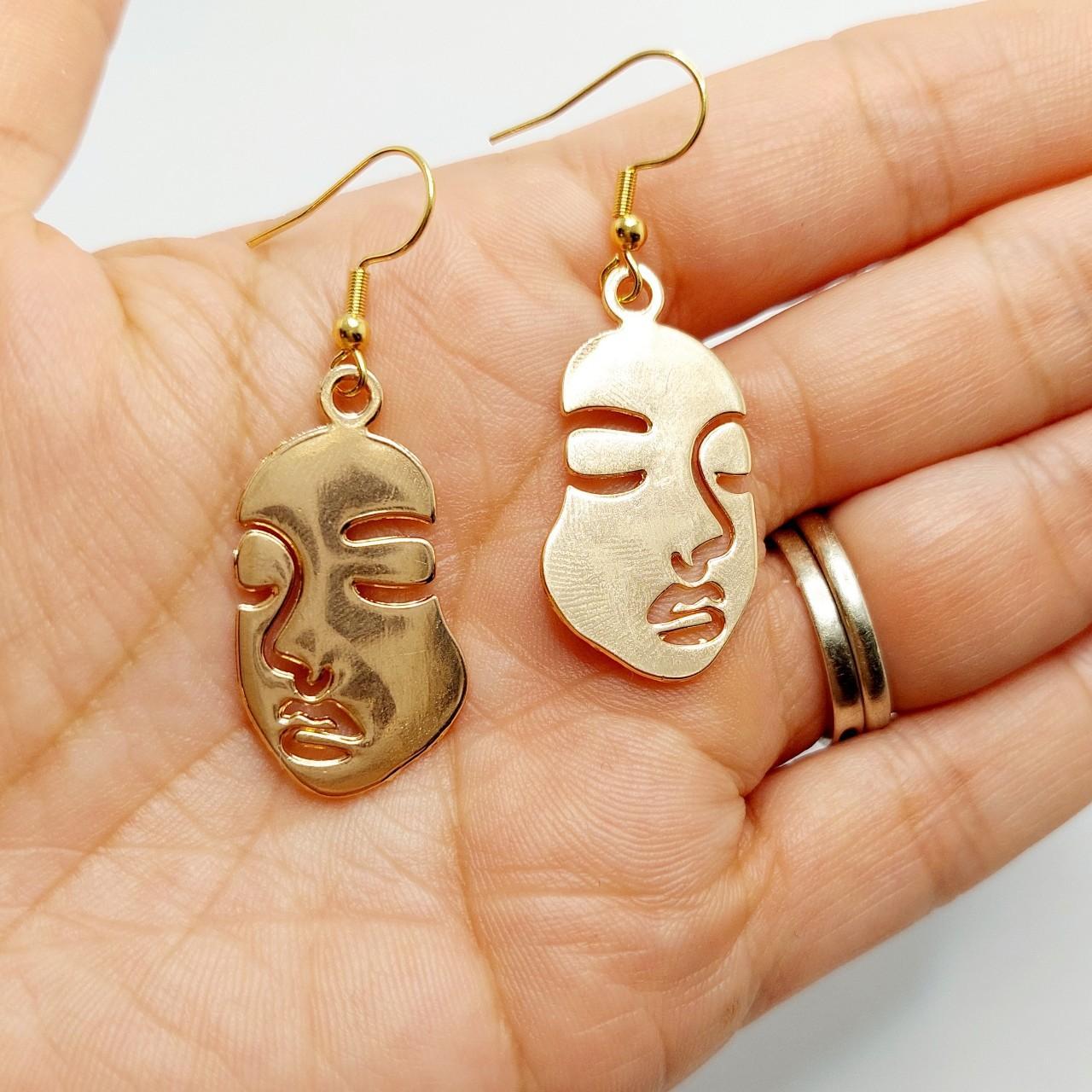 Gold plated stainless steel face charms on stainless... | Depop