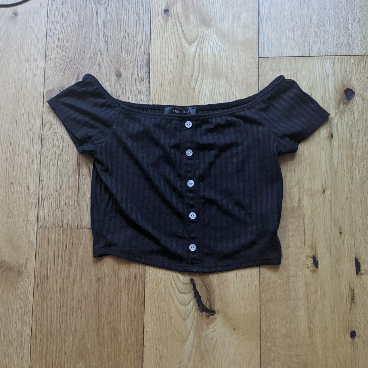 Black ribbed crop top with decorative buttons,... - Depop