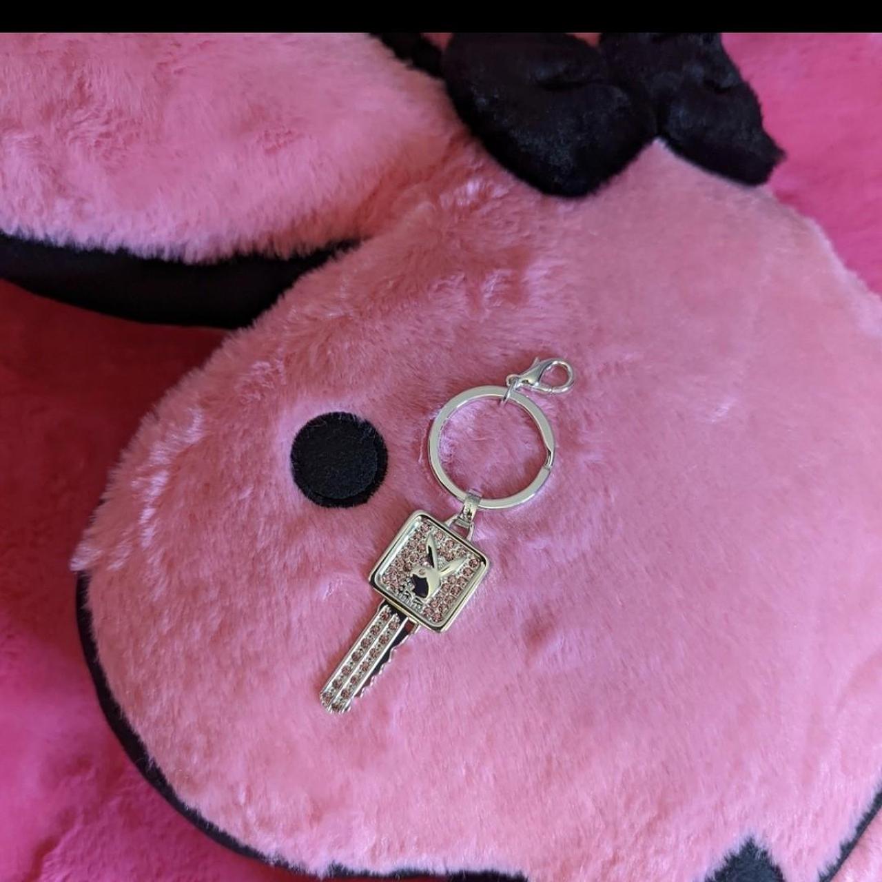 playboy pink key shaped keychain, one side is filled... - Depop