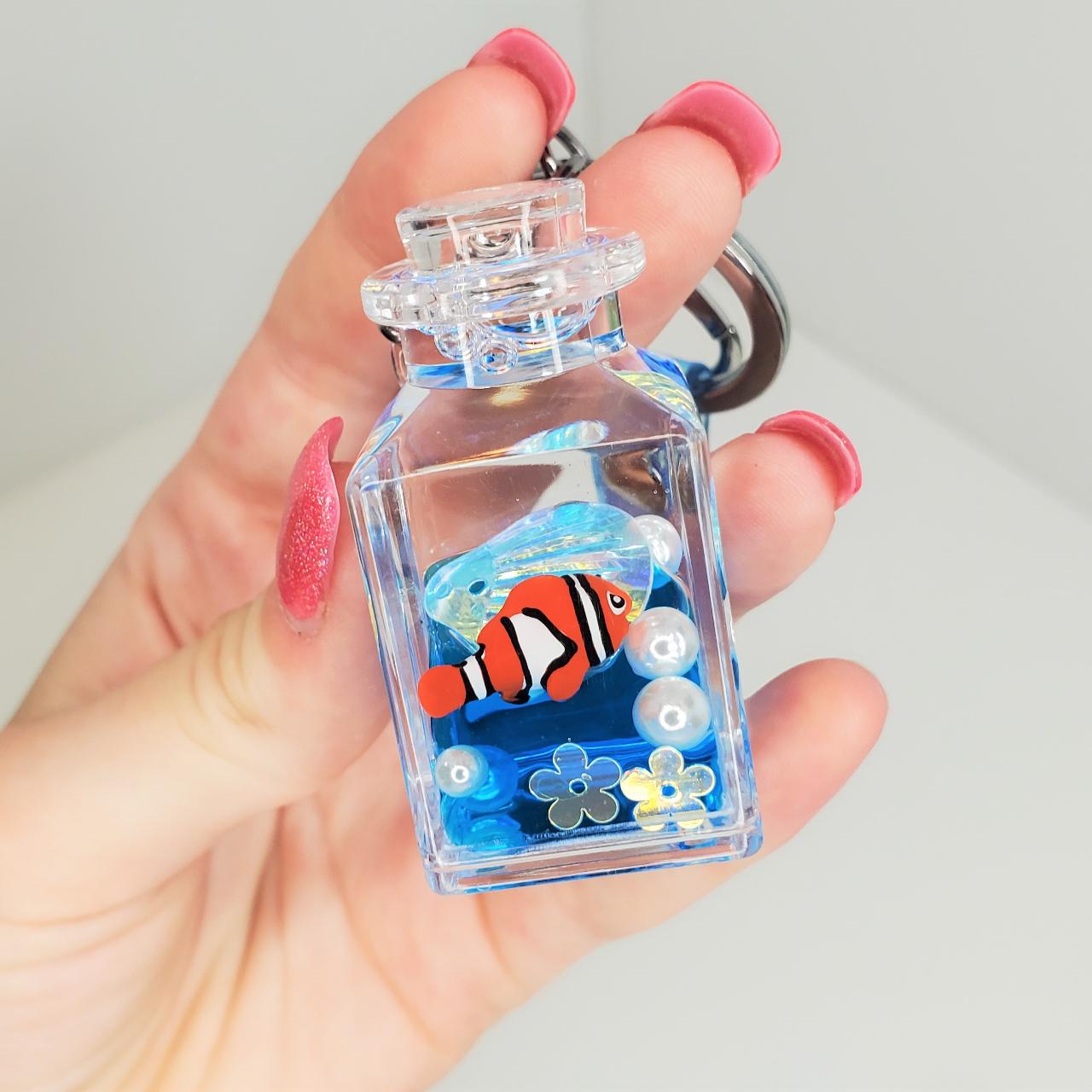 LIQUID GLITTER BOTTLE CLOWN FISH KEYCHAIN - CLEAR... - Depop