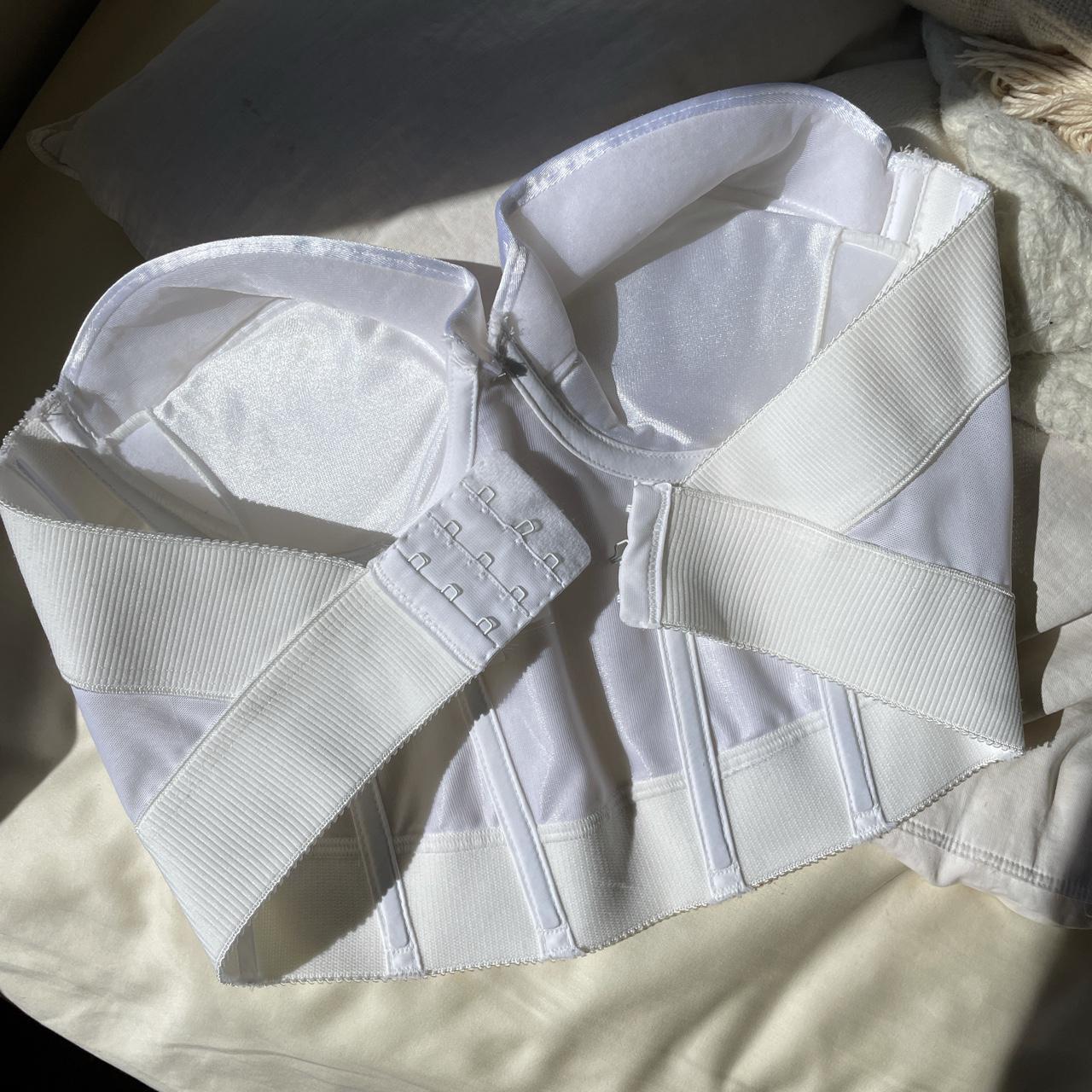 vintage white corset. silky material with white bow... - Depop