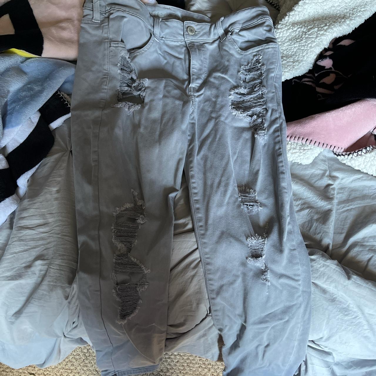 Grey Ripped American Eagle Jeans Size: 16, can fit... - Depop