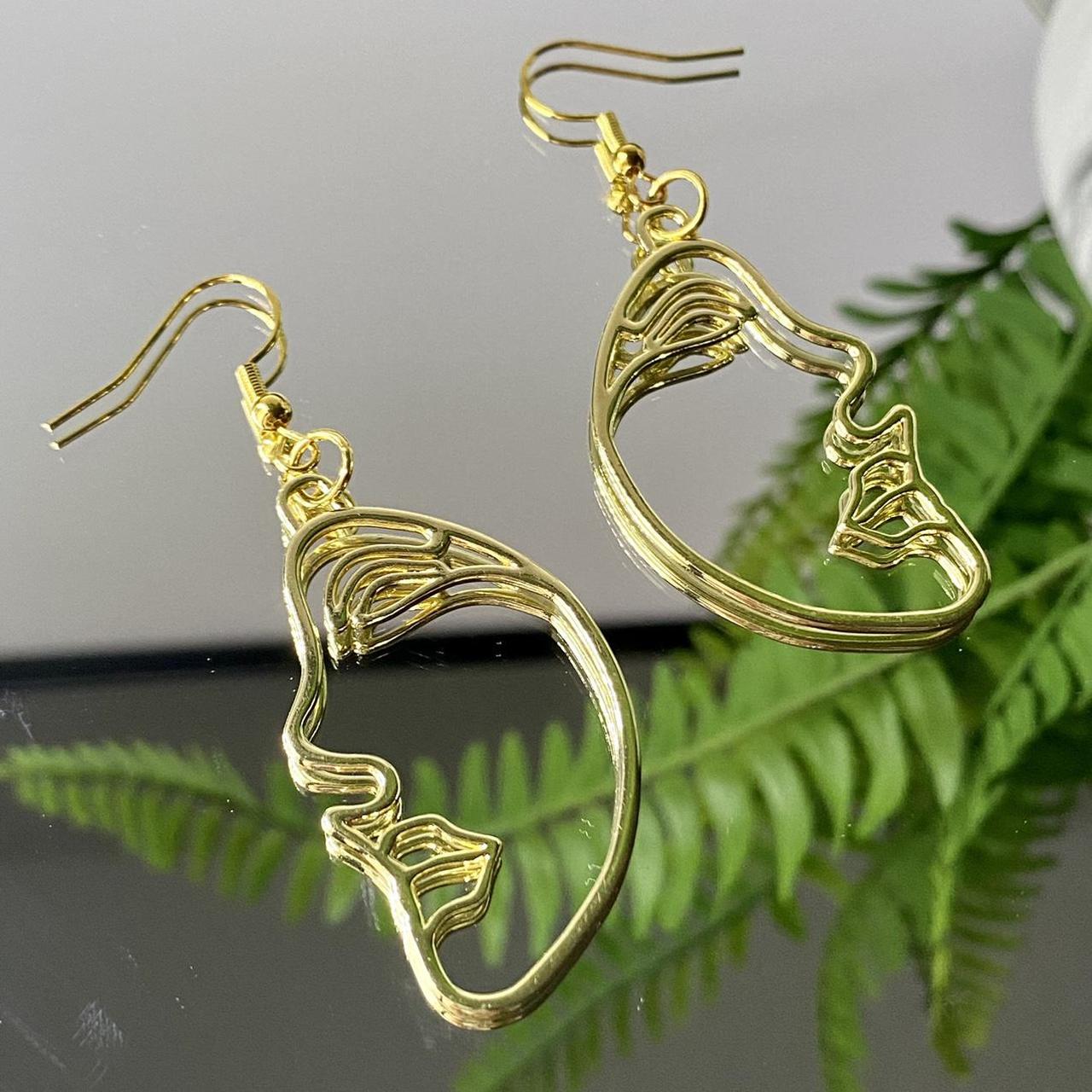 Gold abstract face earrings High quality alloy,... - Depop