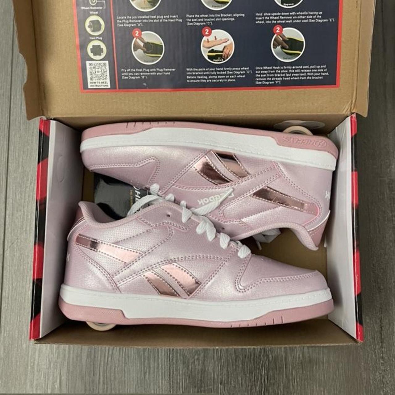 Pink Reebok Heelys In new condition, comes with... - Depop