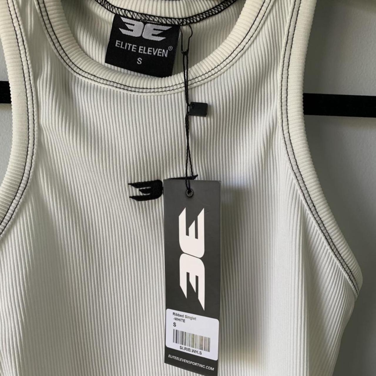 Elite Eleven white ribbed singlet with black... - Depop