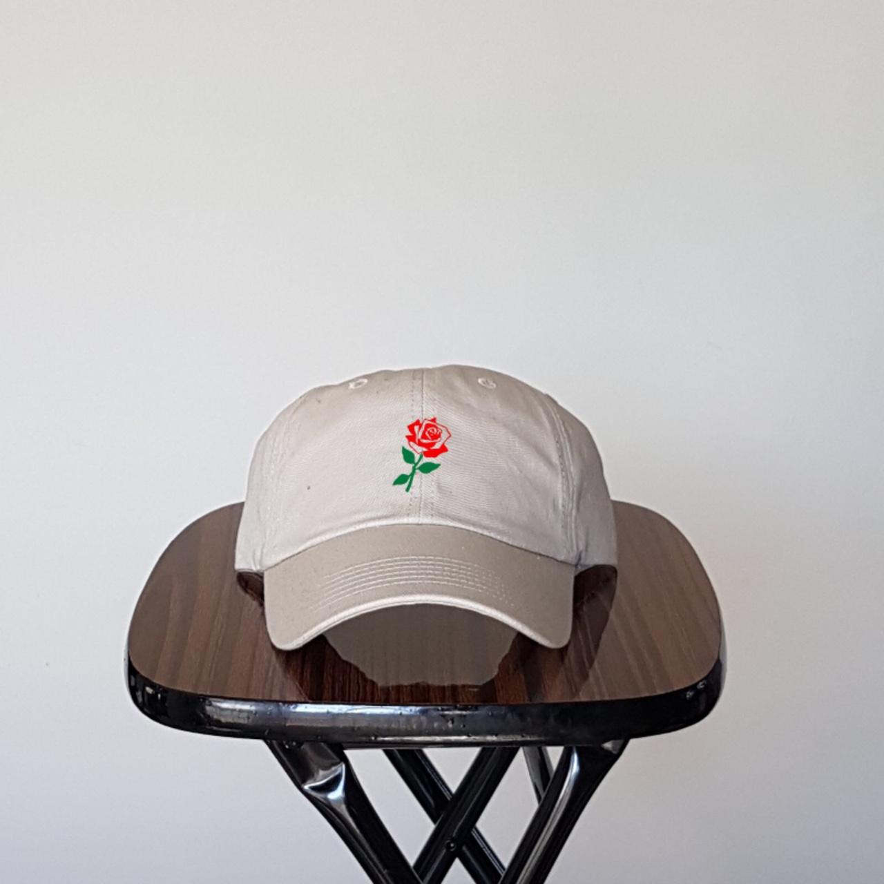 Rose printed on a beige dad hat with strapback... - Depop