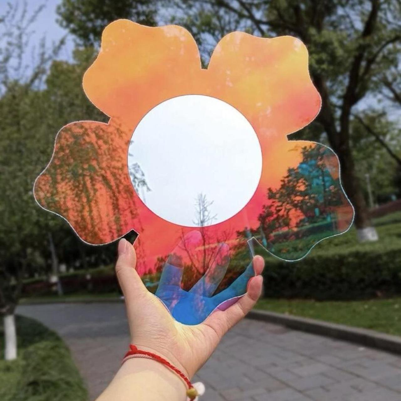 Iridescent flower shaped wall mirror... - Depop