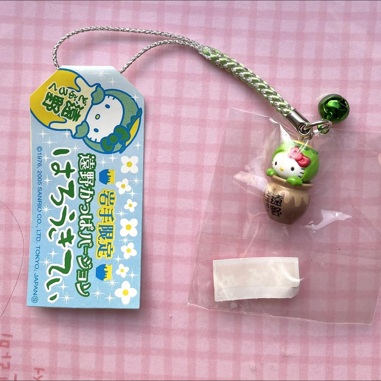 hello kitty wearing a green tono kappa costume... - Depop